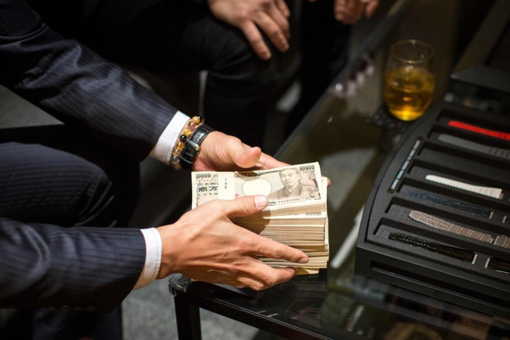 Cash-loving Japanese savers play it safe by hiding money in their homes ...