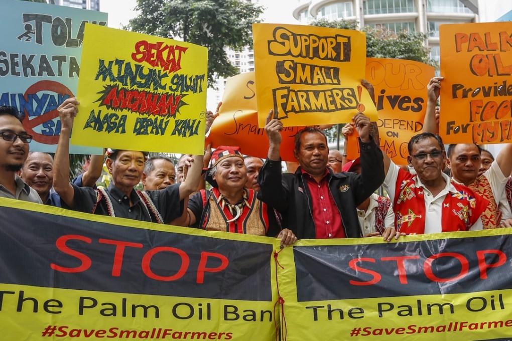 Malaysian palm oil farmers protest ban by European Parliament, claiming ...