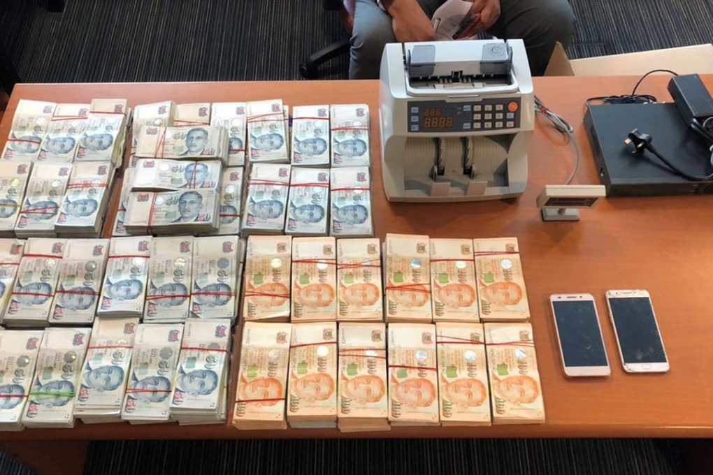 US$443,000 cash seized in Singapore’s largest impersonation scam ...