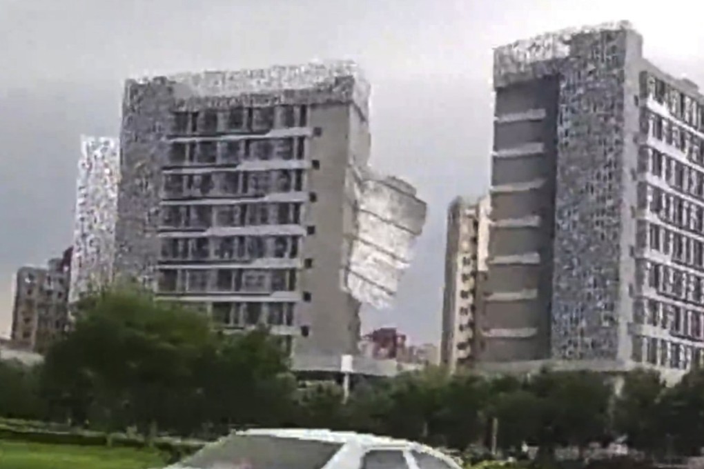 Beijing tower block wall torn off by a gust of wind | South China ...