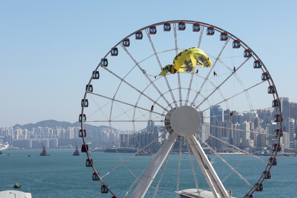 Greenpeace activists who stormed Observation Wheel in Hong Kong to ...