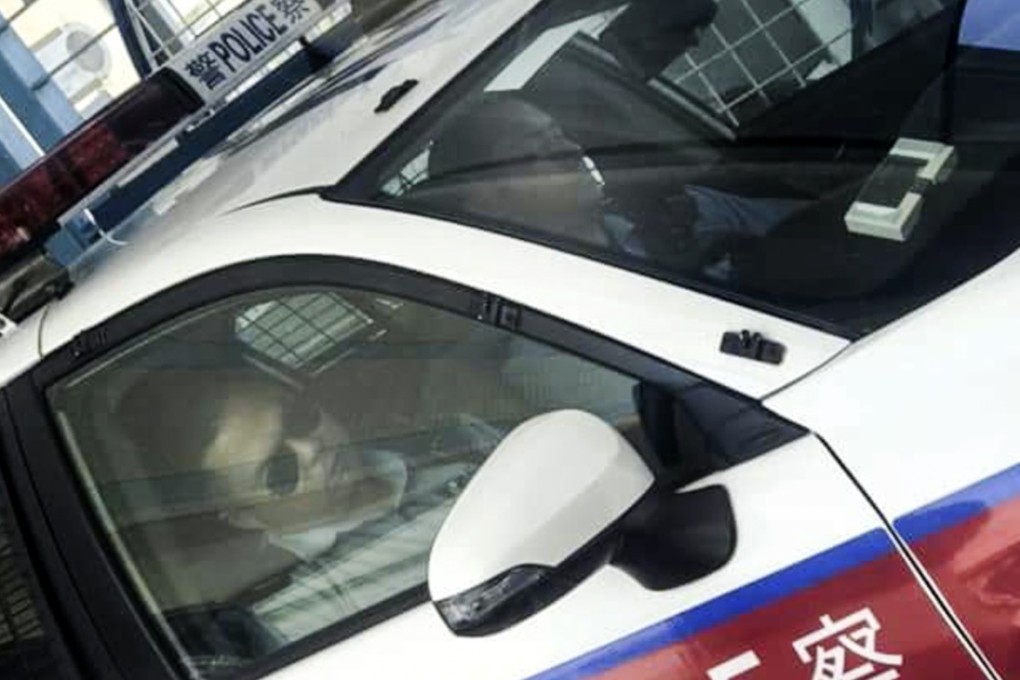 Asleep at the wheel: Hong Kong police officers caught napping outside ...