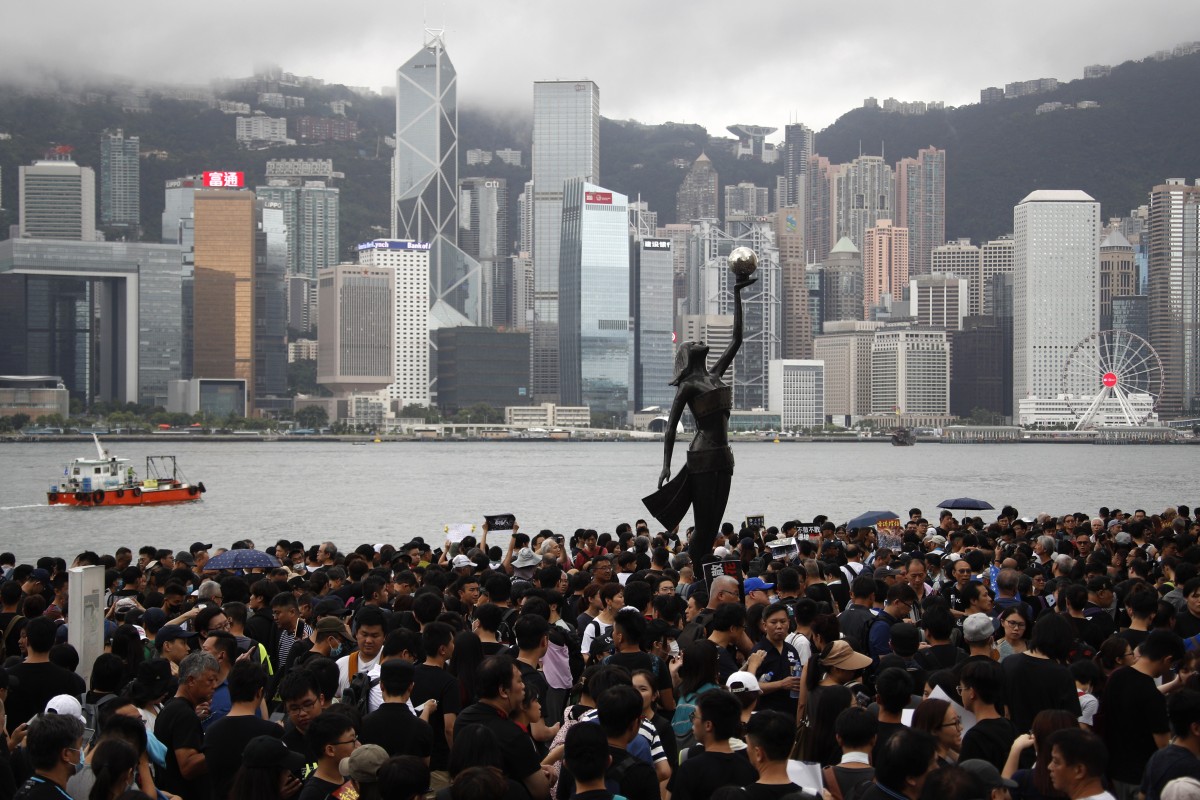 Tens of thousands take to the streets of Kowloon for the first time ...