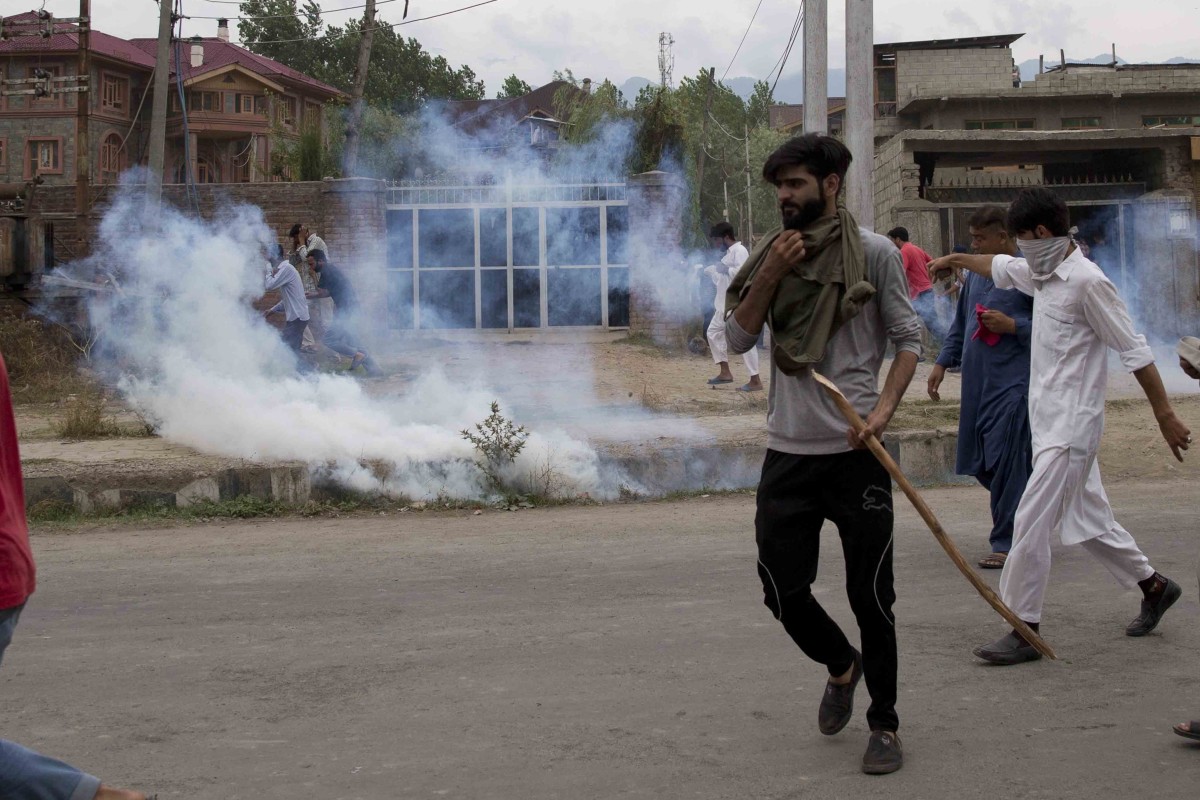 Indian police fire tear gas and pellets as thousands protest in Kashmir ...