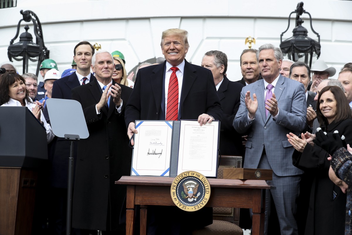 Donald Trump signs trade deal with Canada and Mexico, ‘ending the ...