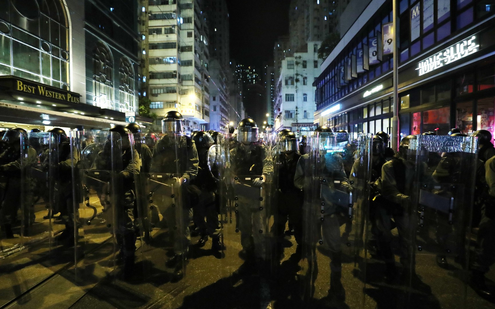 Riot police advance on extradition bill protesters and warn they will ...