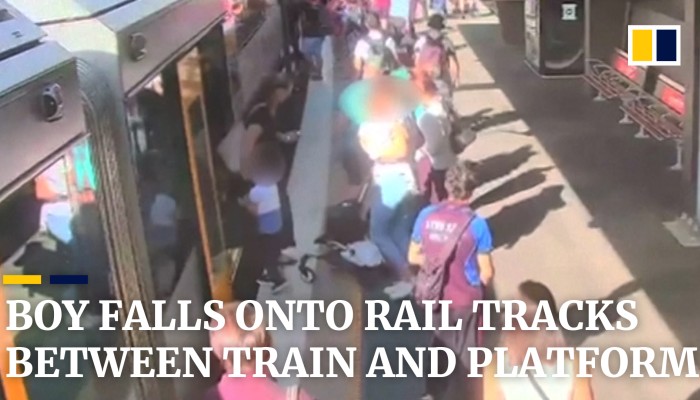 Terrifying moment a little boy falls into gap between train and ...