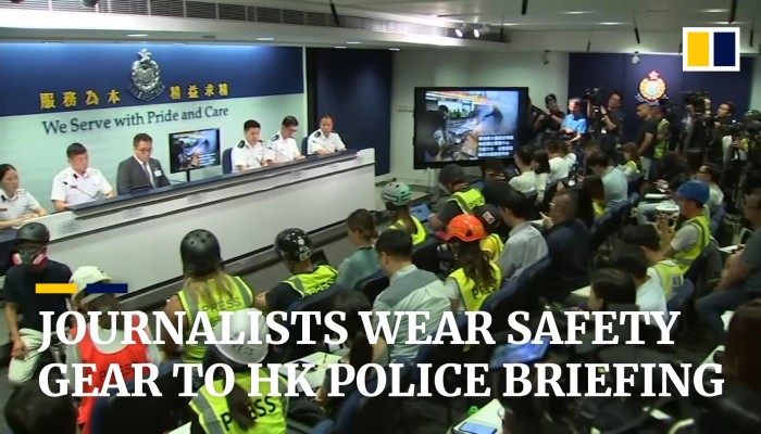 Journalists wear safety gear to Hong Kong police press conference to ...