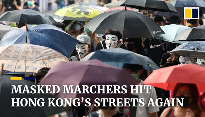 Thousands of masked marchers take to Hong Kong’s streets protesting the ...