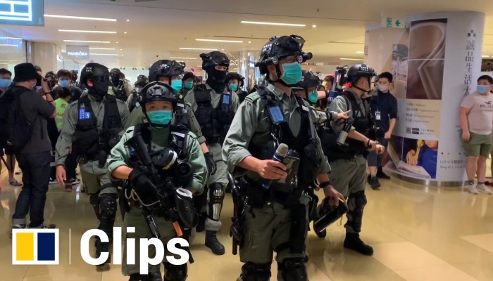 Riot police cleared a shopping mall after a peaceful protest started ...