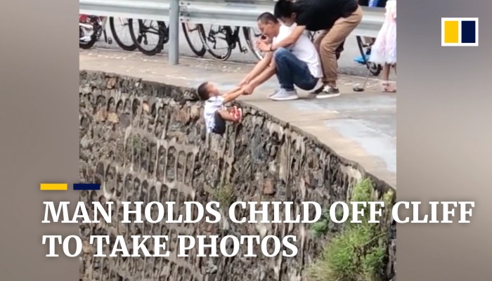 Man holds child off cliff to take photos in China | South China Morning ...