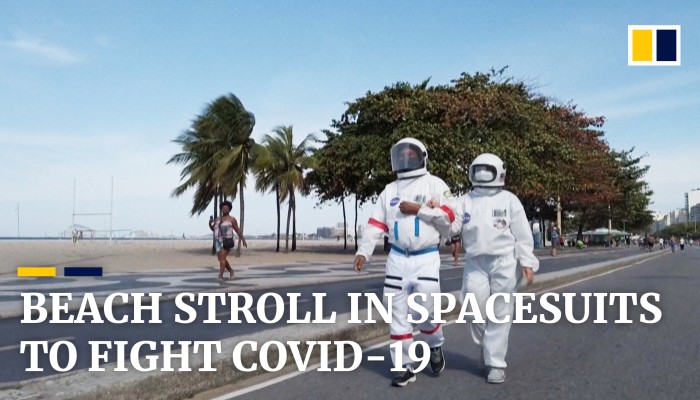 Brazilian couple wear spacesuits to the beach as protection against ...