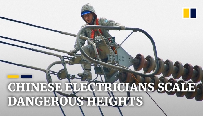 Chinese electricians scale dangerous heights to work on high-voltage ...