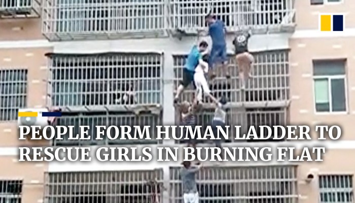 People in China form human ladder to rescue girls from burning flat ...
