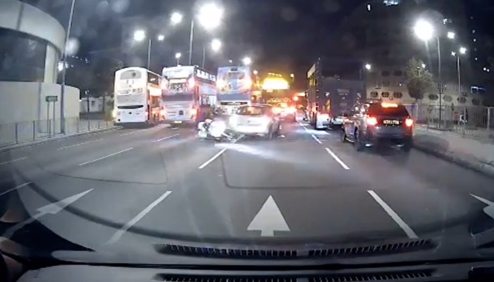 Dashcam video shows car backing into a police motorcycle in Hong Kong ...