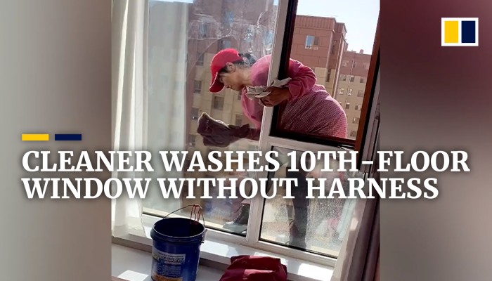 Cleaner climbs outside to wash 10th-floor window without harness in ...