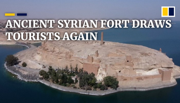 Tourists return to ancient fortress in war-torn Syria once used by ...