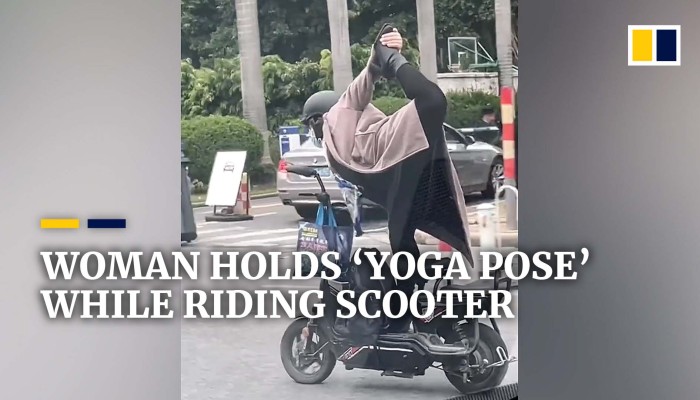 Chinese woman holds ‘yoga pose’ while riding scooter | South China Morning Post