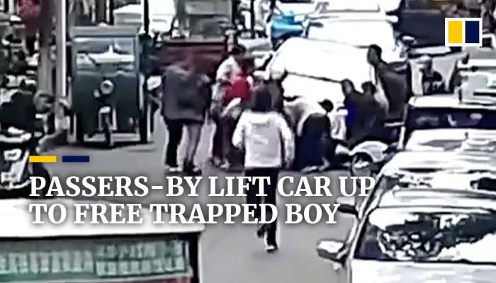 Chinese passers-by lift car up to free trapped boy | South China ...