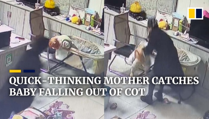 Quick-thinking mother in China catches baby falling out of cot | South ...