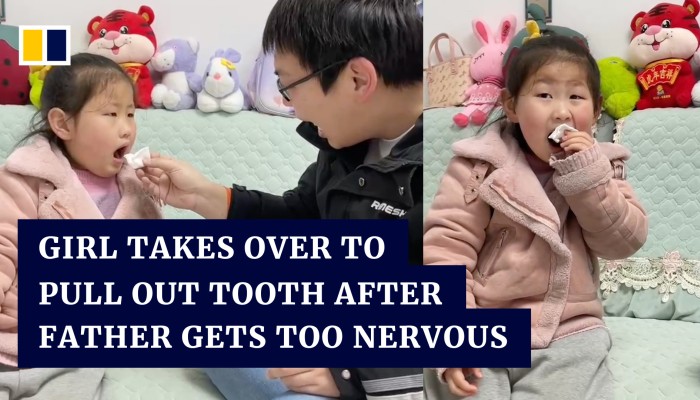 Chinese girl takes over to pull out her loose tooth after her father ...