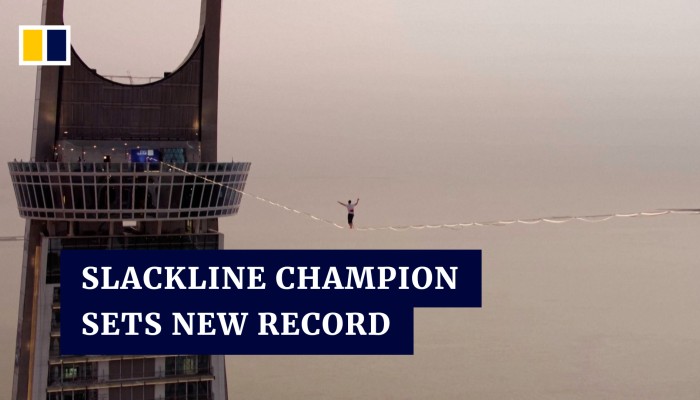 Slackline champion completes world’s longest single-building walk ...