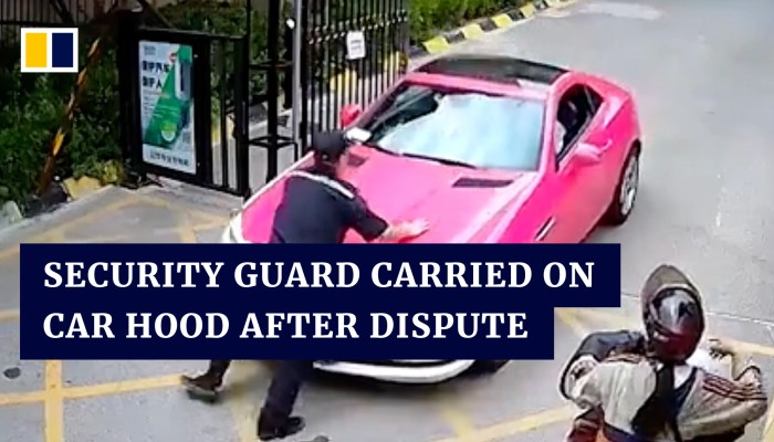 Security guard carried on hood of car after dispute in China | South ...