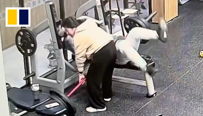 Woman saves trainer pinned under 110kg weight | South China Morning Post