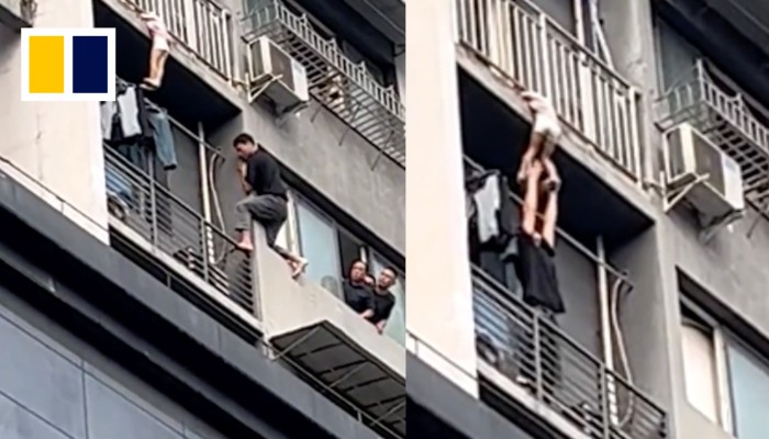 Heroic man holds up child dangling from balcony | South China Morning Post