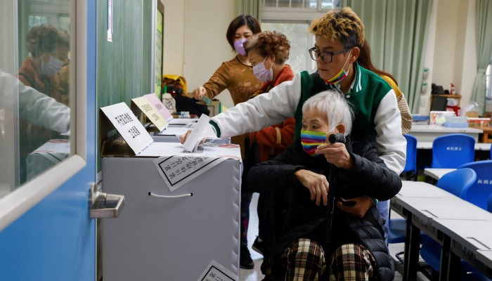 Voters and candidates cast their ballots in Taiwan’s critical ...
