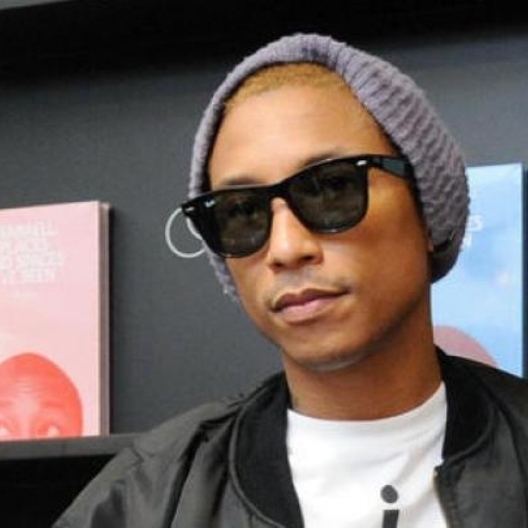 Jet-lagged rapper Pharrell Williams thrills his fans at book signing ...