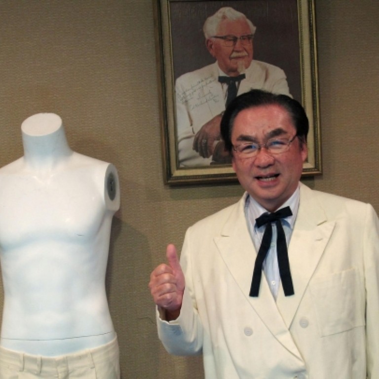 KFC Japan chief buys 'colonel's' suit at Texas auction and tries it on ...