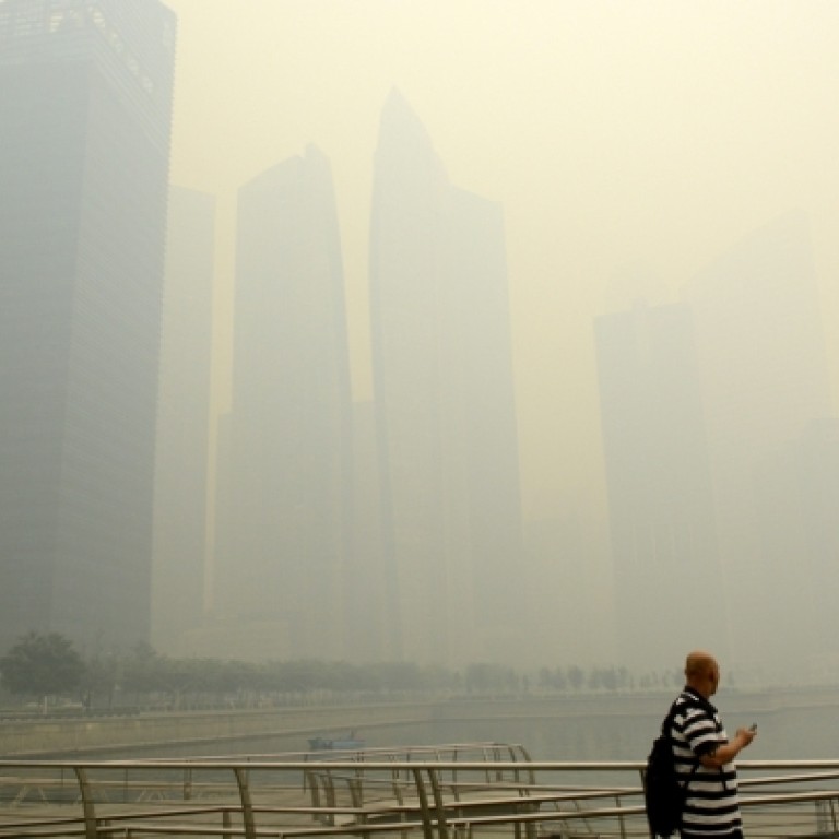 Singapore threatens legal action against local firms blamed for smog ...
