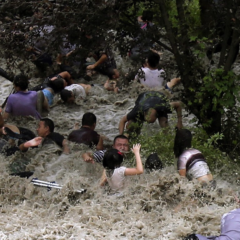 Pictures: the moment a monster Qiantang River tidal wave washed ...