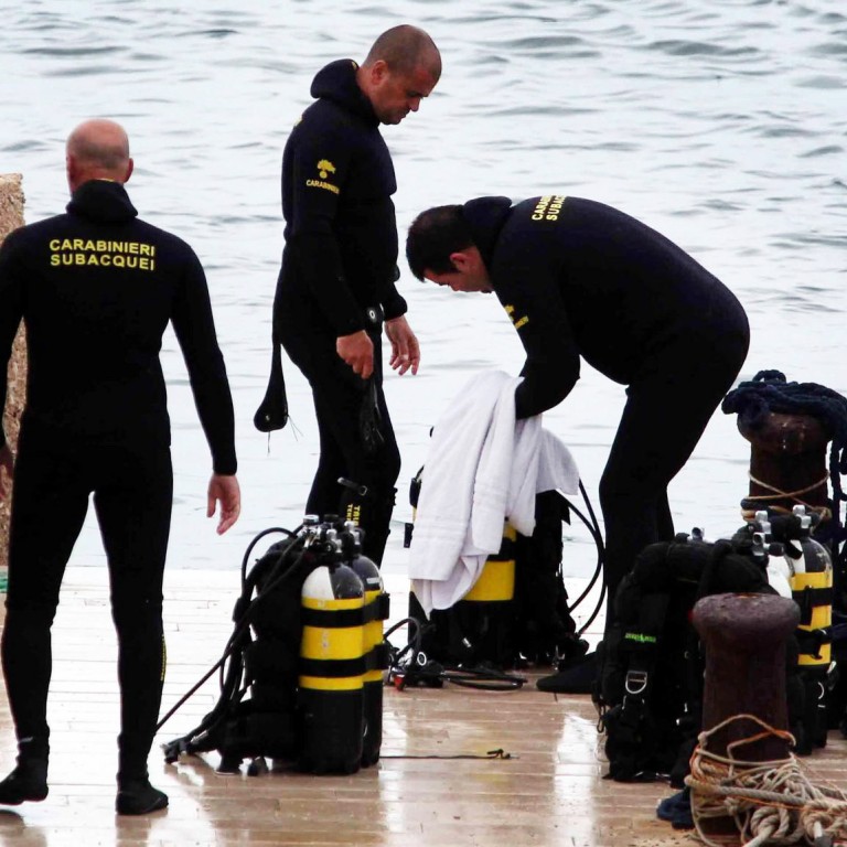 Italian divers find wall of bodies in hull of capsized migrant trawler ...