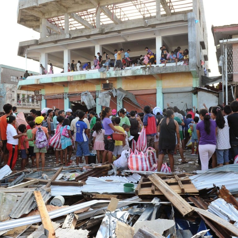 In Guiuan, town hit first by typhoon, armed thieves roam a wasteland ...