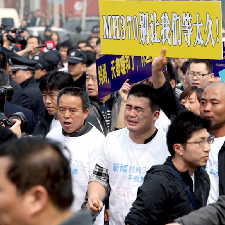 Hundreds march on Malaysian embassy in Beijing as MH370 passengers ...