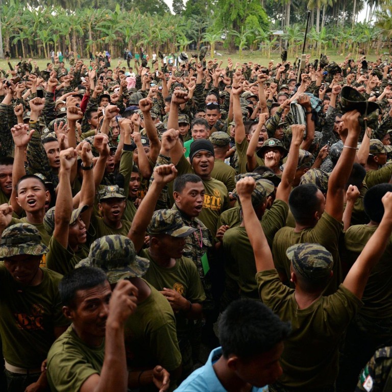 Manila seals historic peace pact with Muslim rebel group Moro Islamic ...