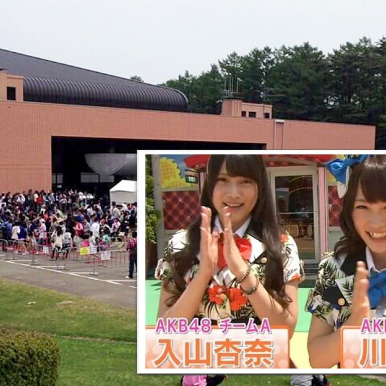 Slasher attacks Japan female pop group AKB48 with saw at fan event ...
