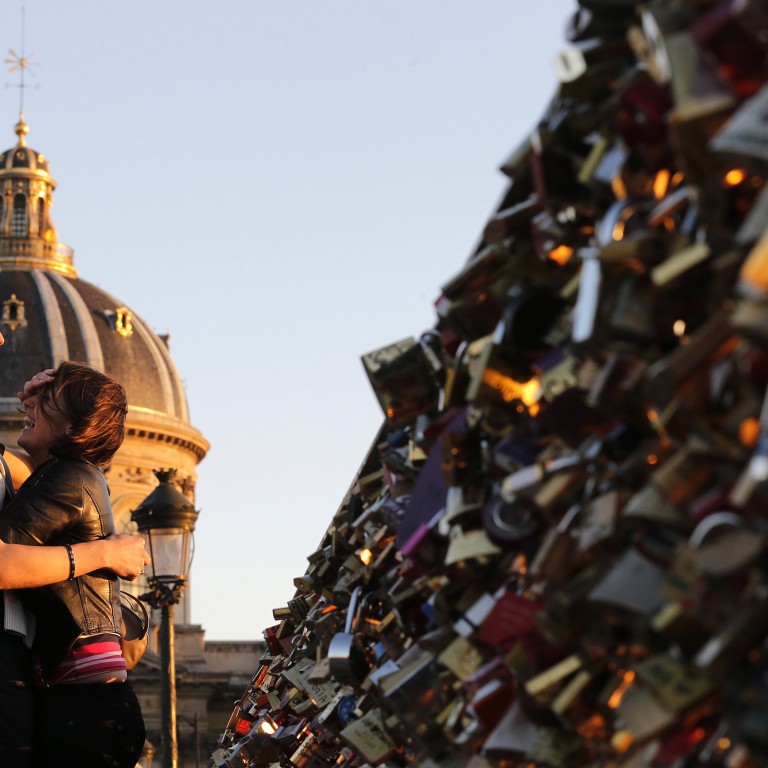‘Locks of love’ bridge in Paris evacuated after railing collapse ...