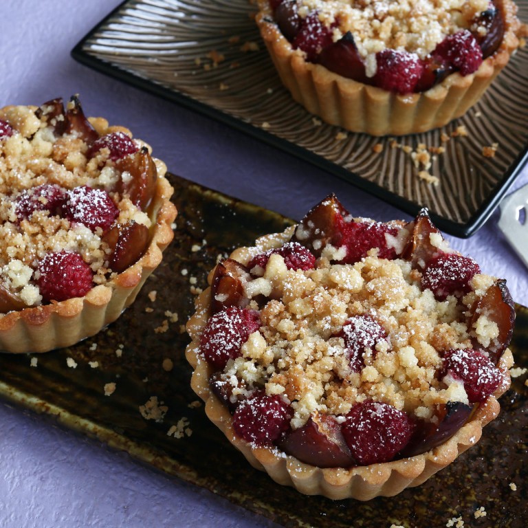 Plum and raspberry tarts with streusel topping, and sautéed plums with ...
