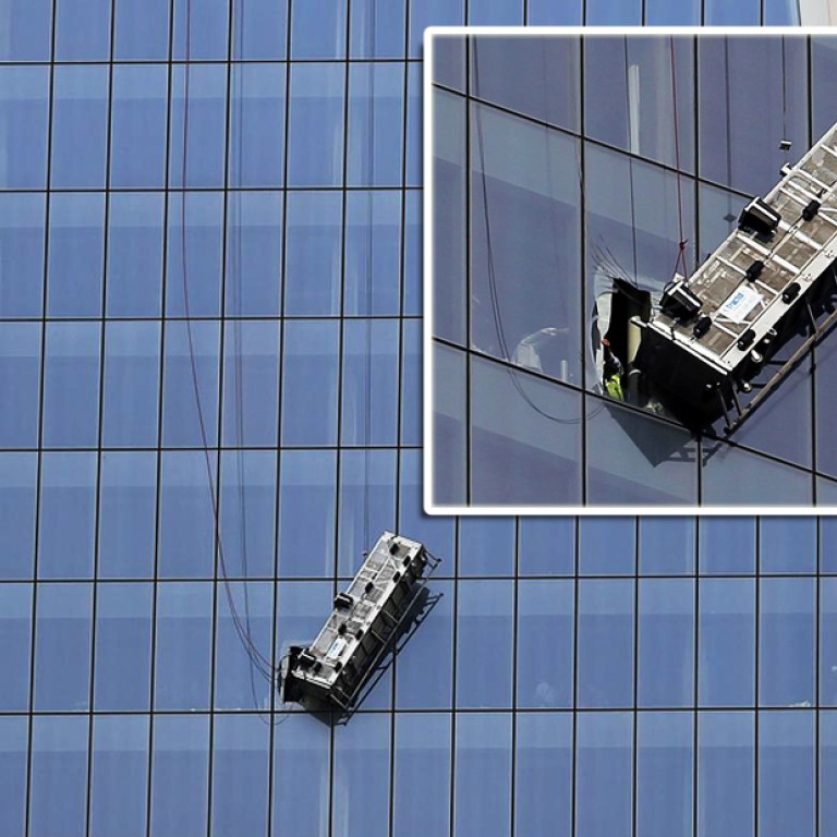Don't leave me hanging: Dangling window cleaners rescued from World ...