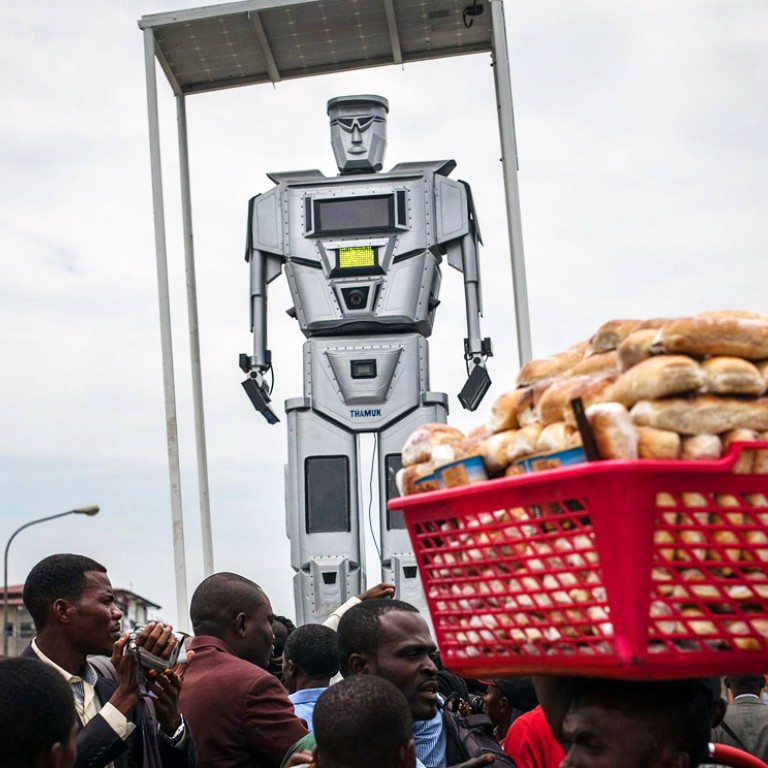 Solar-powered robocops installed to control traffic chaos on Kinshasa ...