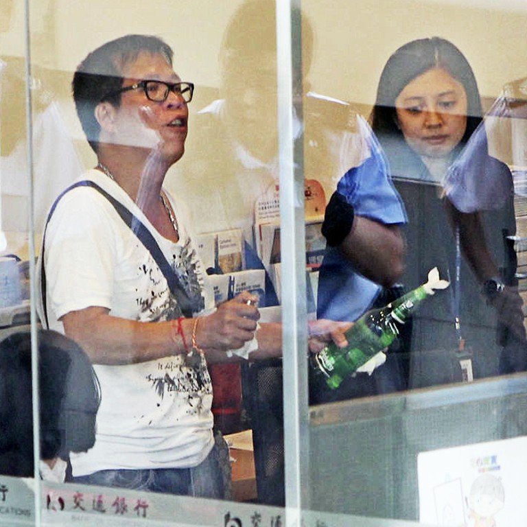 Robber ‘holding flammable liquid and lighter’ holds two staff hostage ...