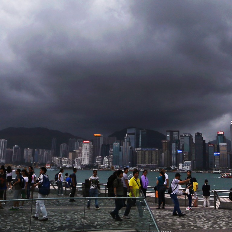 Flights cut, MTR trains down, trees uprooted and runner rescued in Hong ...