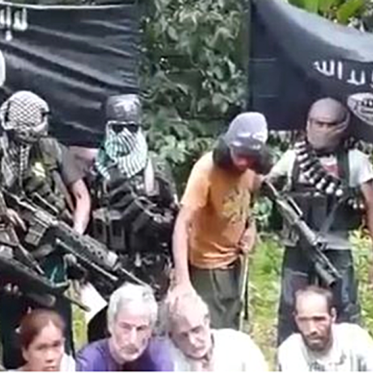 Foreign hostages in Philippines make plea in video surrounded by ...