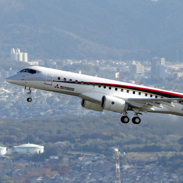 Japan’s first passenger jet makes maiden test flight, days after China ...