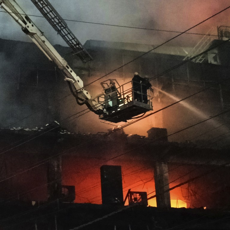 Fire in commercial building in India kills at least 27 | South China ...