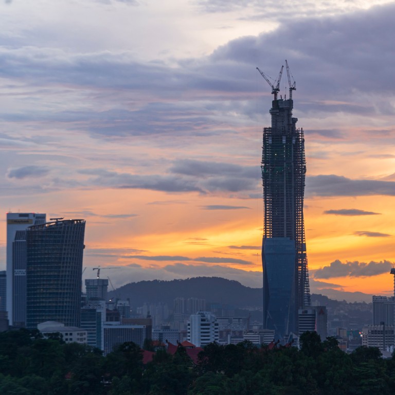 Malaysia investigates ‘daredevil’ Russian couple for climbing Merdeka ...