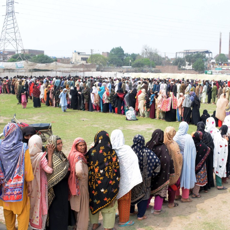 Deadly stampede for food aid kills 12 in southern Pakistan as economic ...